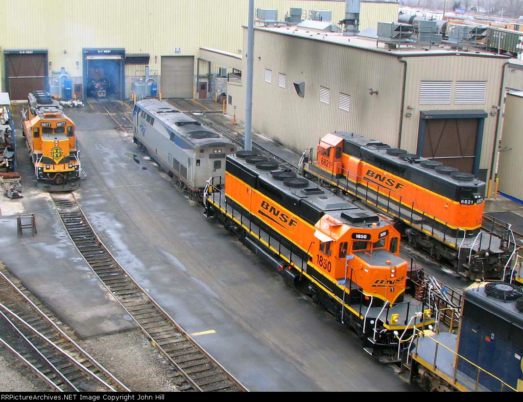 090320002 BNSF 687;-1850-6821 AMTK 62 at Northtown diesel shop